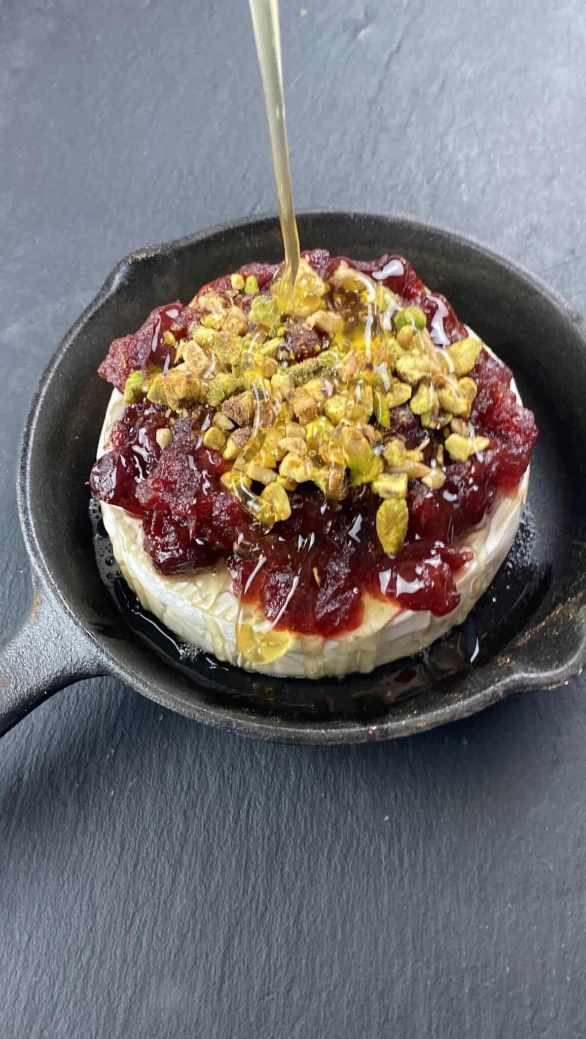 Cranberry Baked Brie with Honey and Pistachios