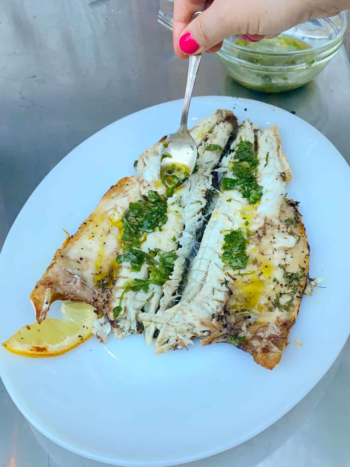 Grilled Branzino with Lemon Slices, Fresh Herbs and Citrus Olive OIl