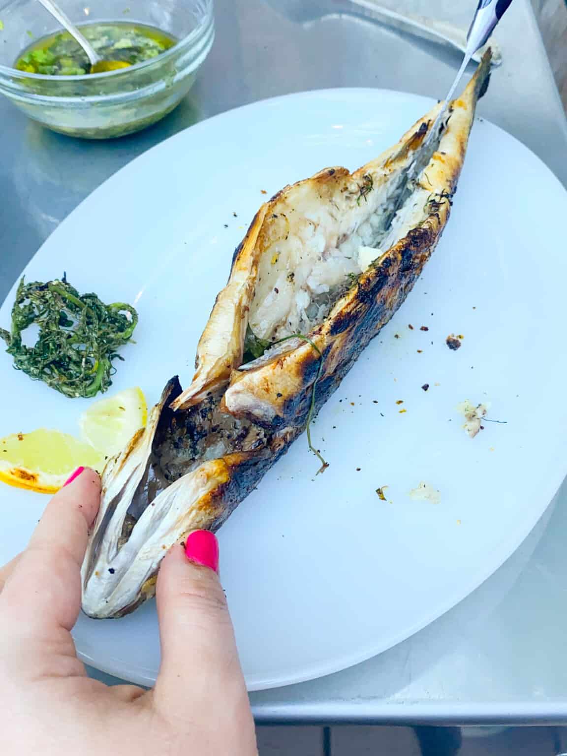 Grilled Branzino with Lemon Slices, Fresh Herbs and Citrus Olive OIl